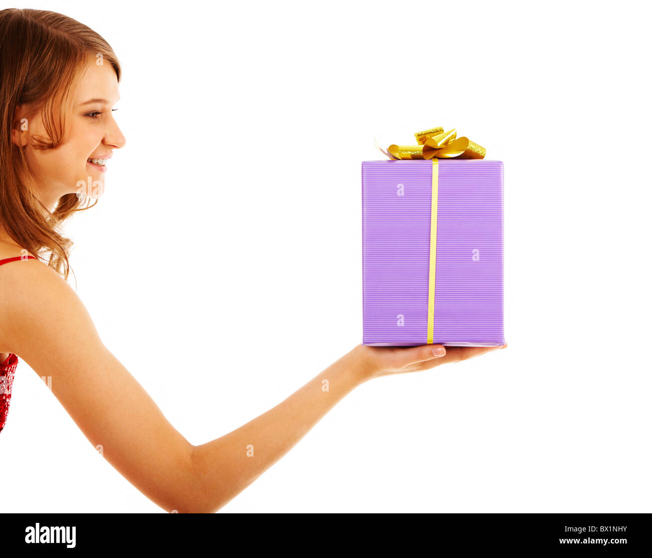 Photo of young beautiful woman making a present Stock Photo - Alamy
