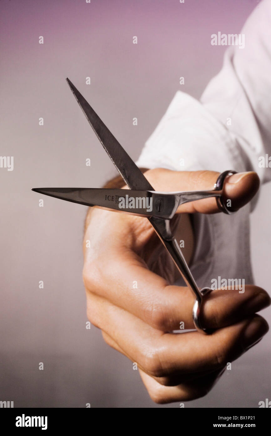 Pincers hand symbol edges knife-edges splitting cutting through ...