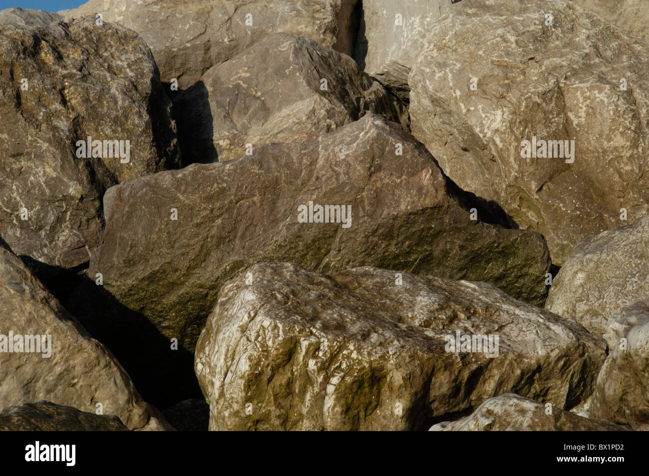 rocks coast lumps rock sea stone lump Stones Stock Photo - Alamy