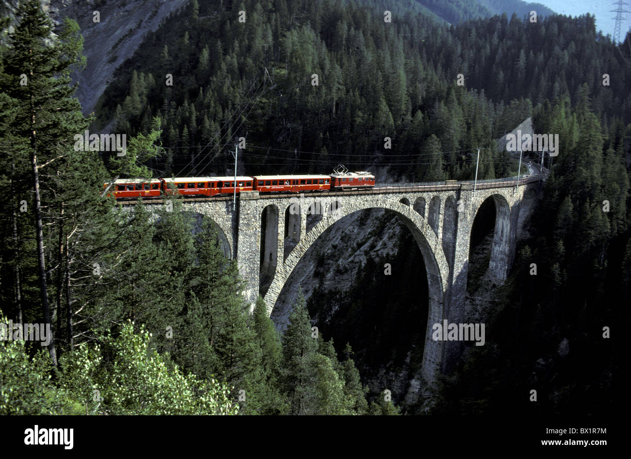 bridge Grisons Graubunden gulch mountains public traffic railroad ...
