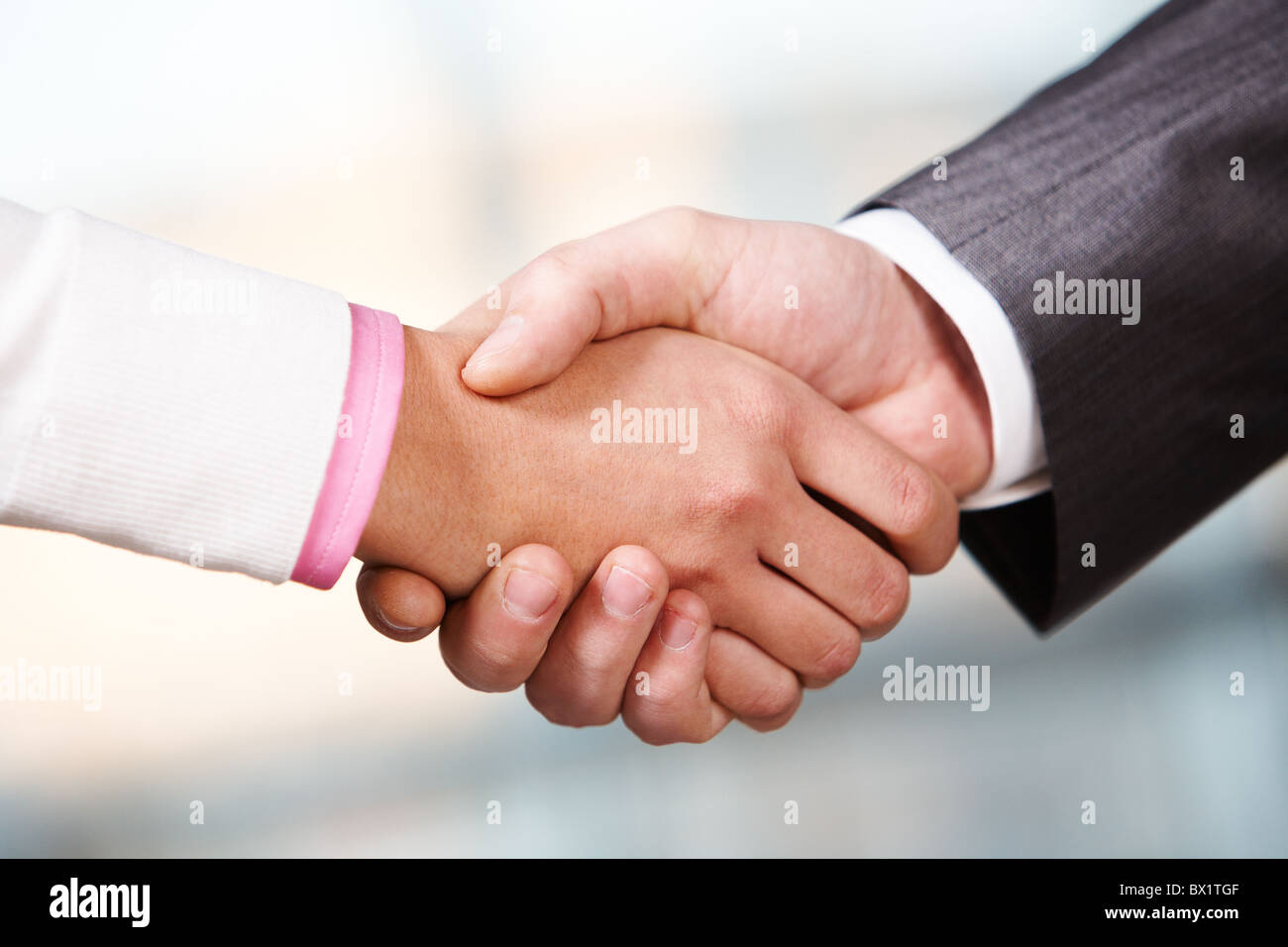 Image of partners handshake after signing contract Stock Photo - Alamy