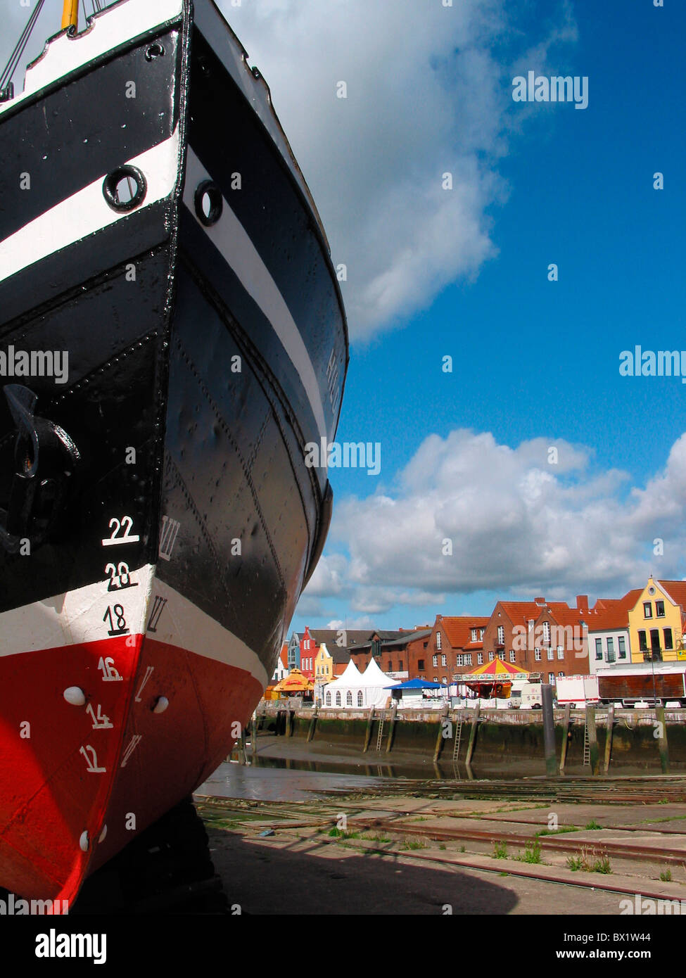 boats bow bug city coast ebb tide fish cutter Germany Europe harbor low ...