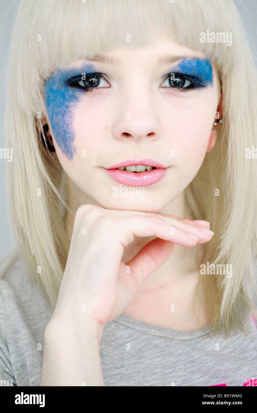 Casual fashion portrait of a young blonde model wearing a tee shirt and ...