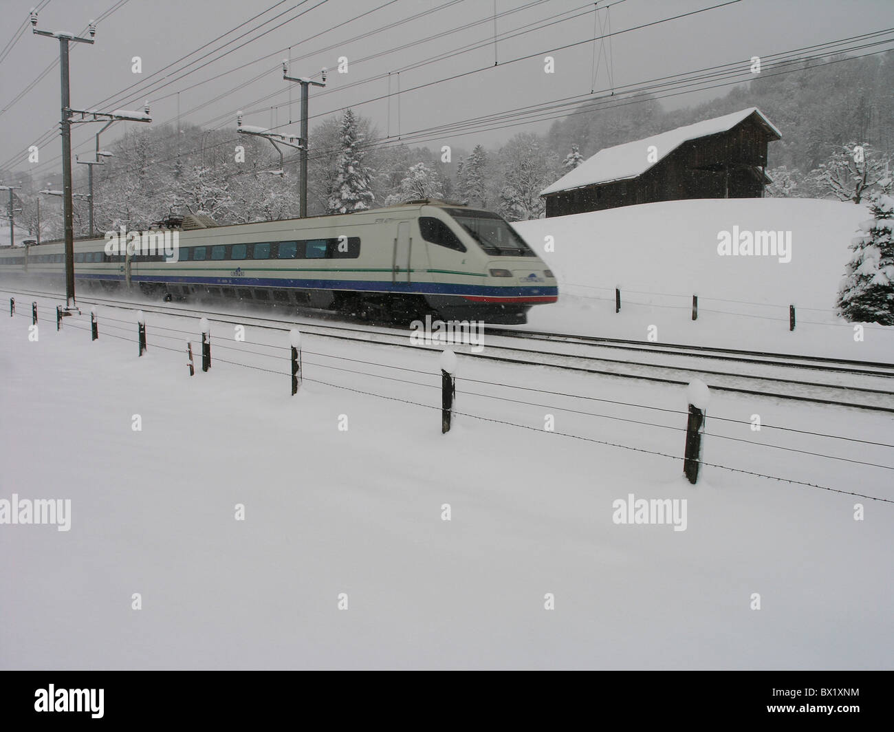 Cisalpino Pendolino railroad rails railway snow Switzerland Europe ...