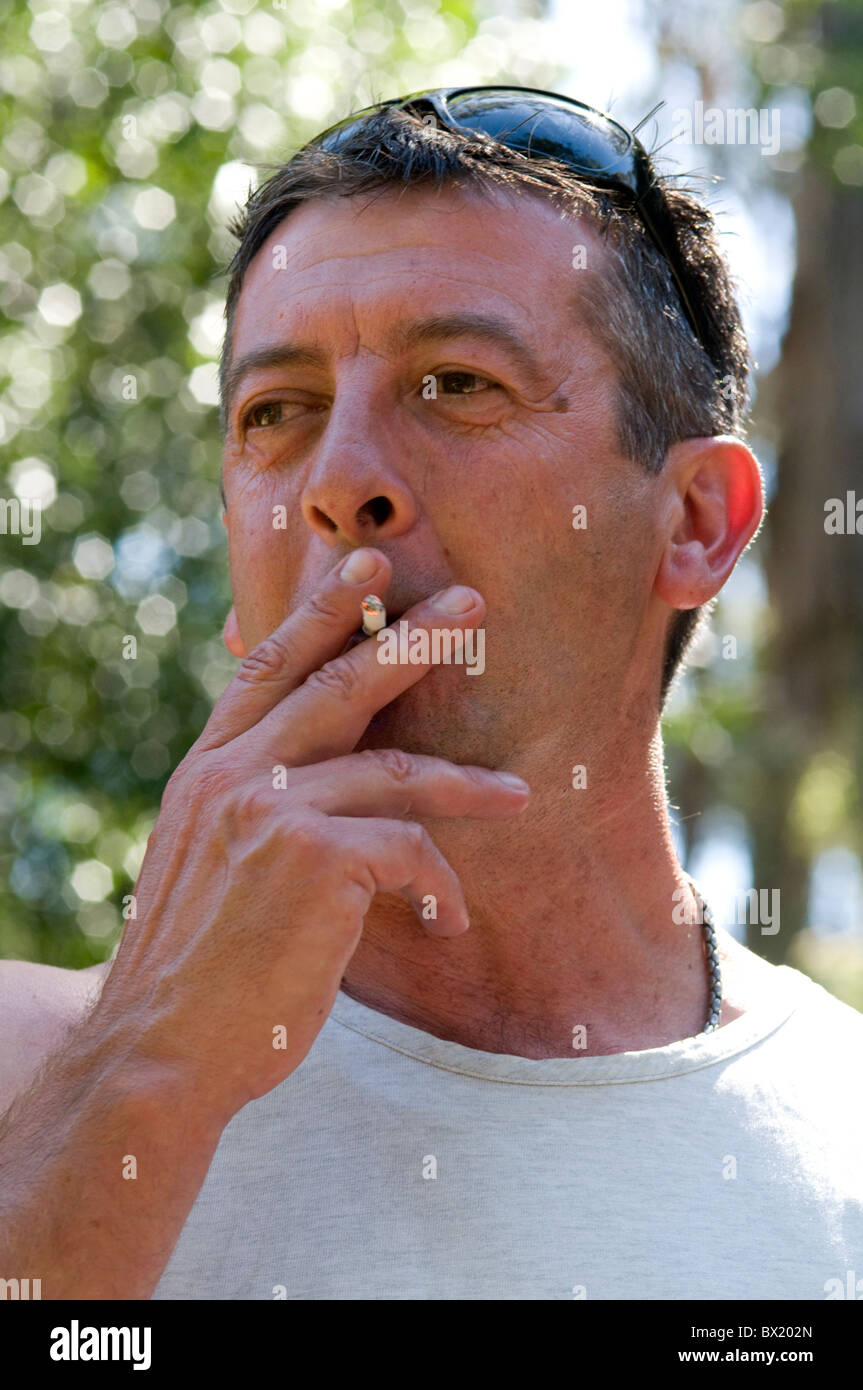 Middle aged man smoking cigarette hi-res stock photography and images ...
