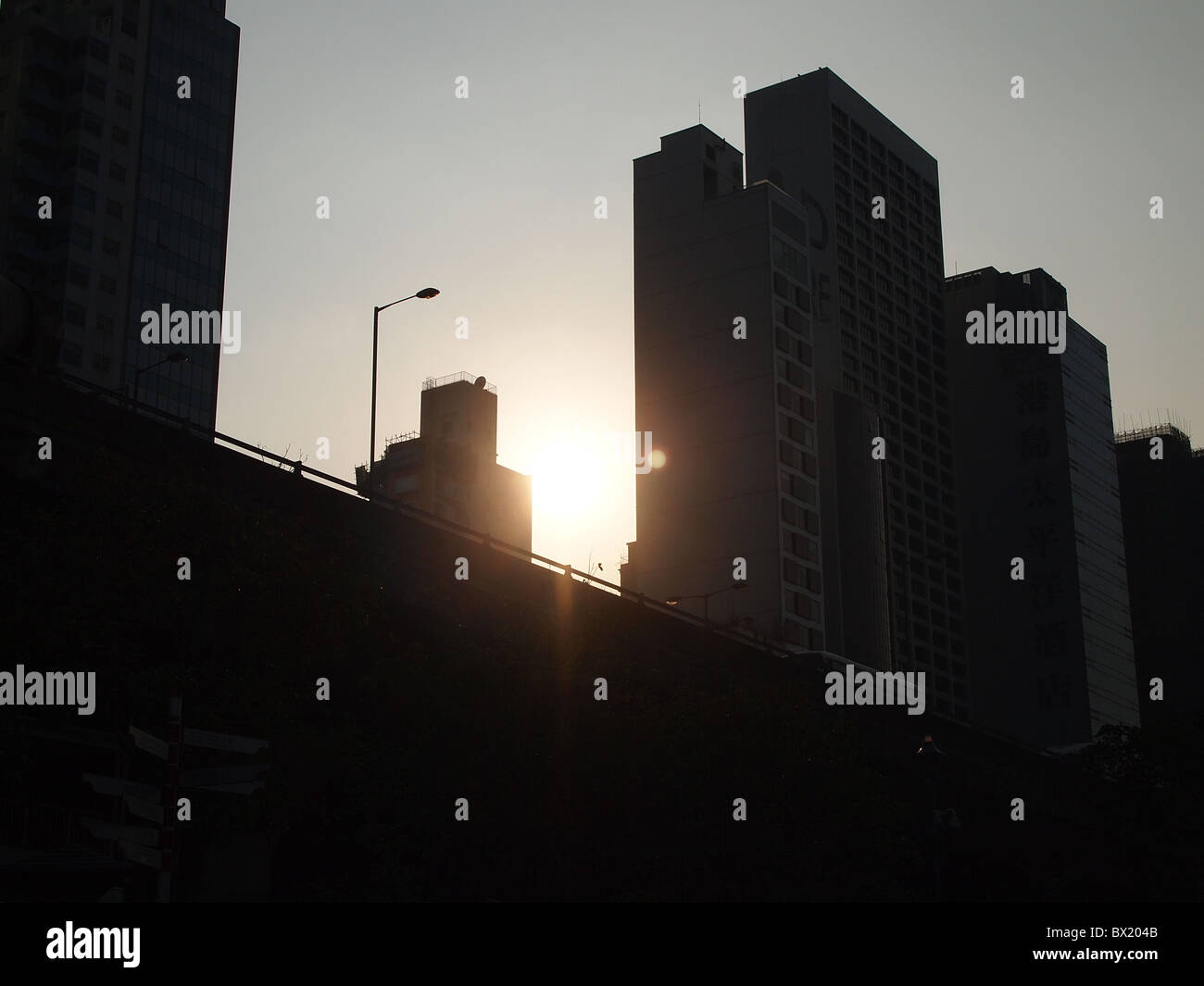 Sunset behind buildings Stock Photo - Alamy