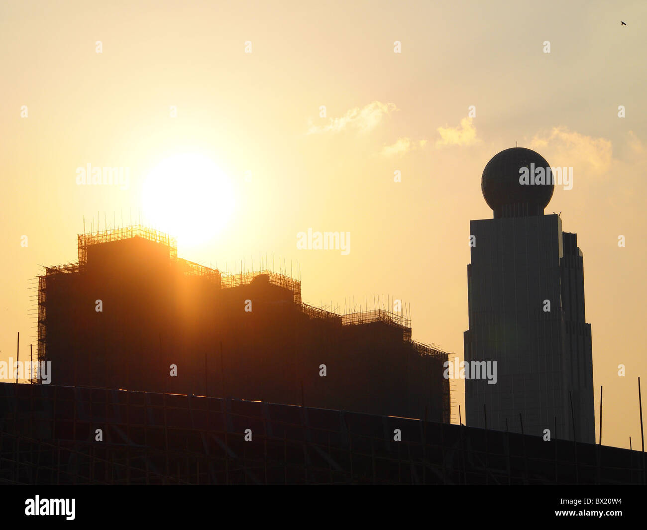 Sunset behind buildings Stock Photo - Alamy