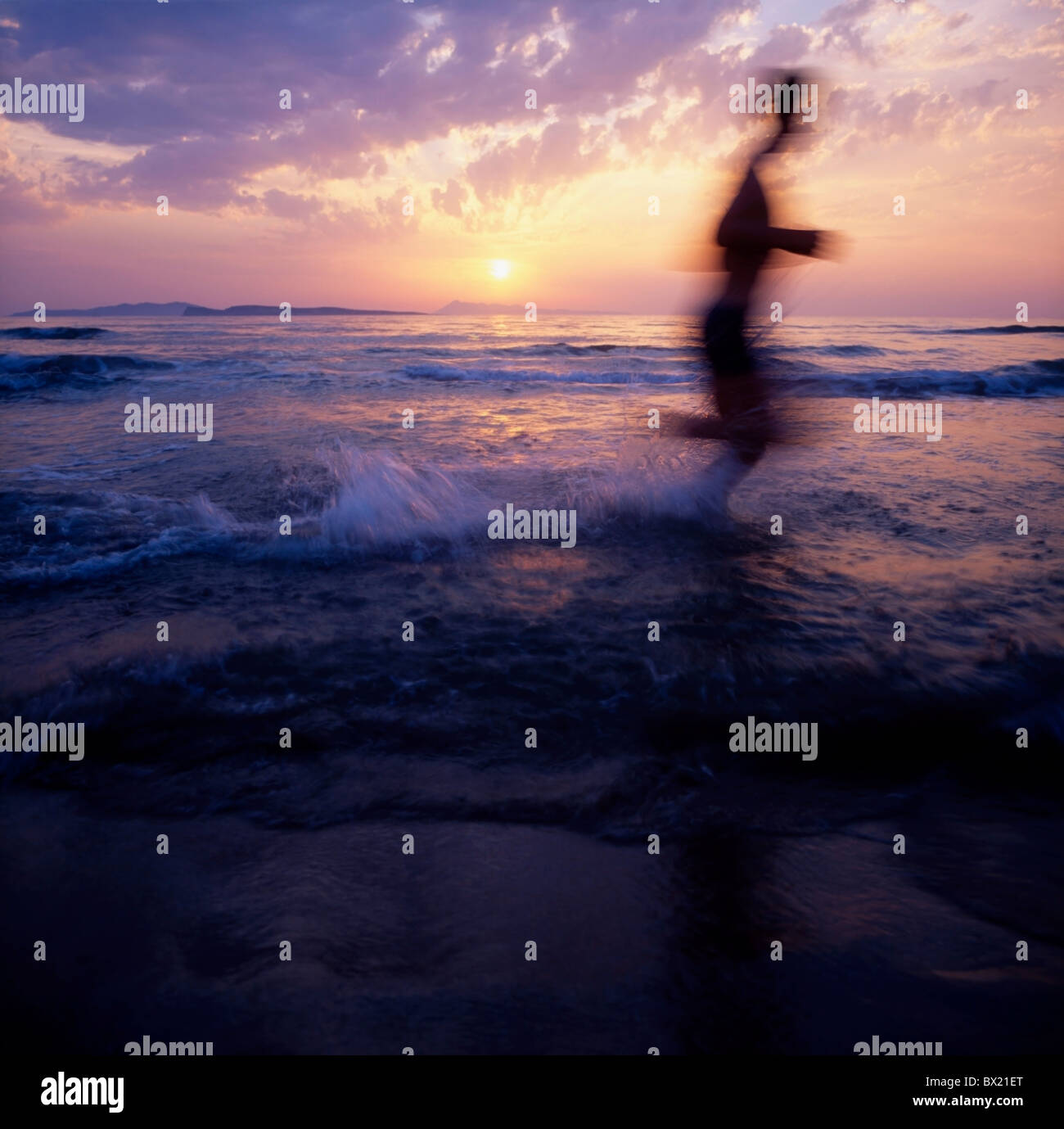 Man Running On Beach At Sunset, Ireland Stock Photo - Alamy