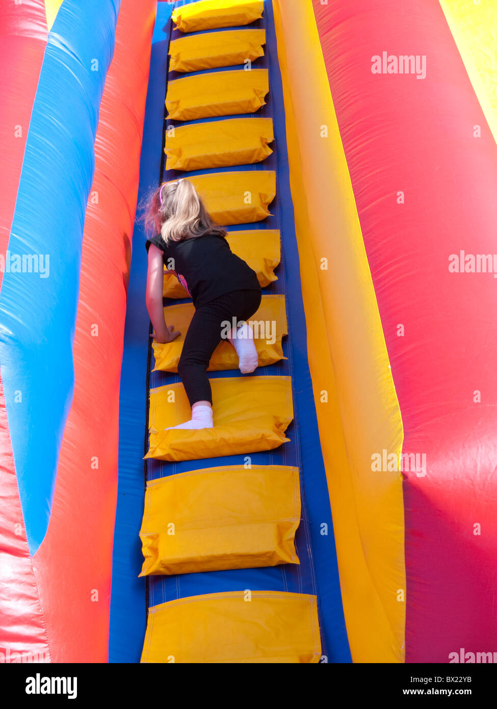 Child climbing inflatable ladder in Burnley Community Festival in ...