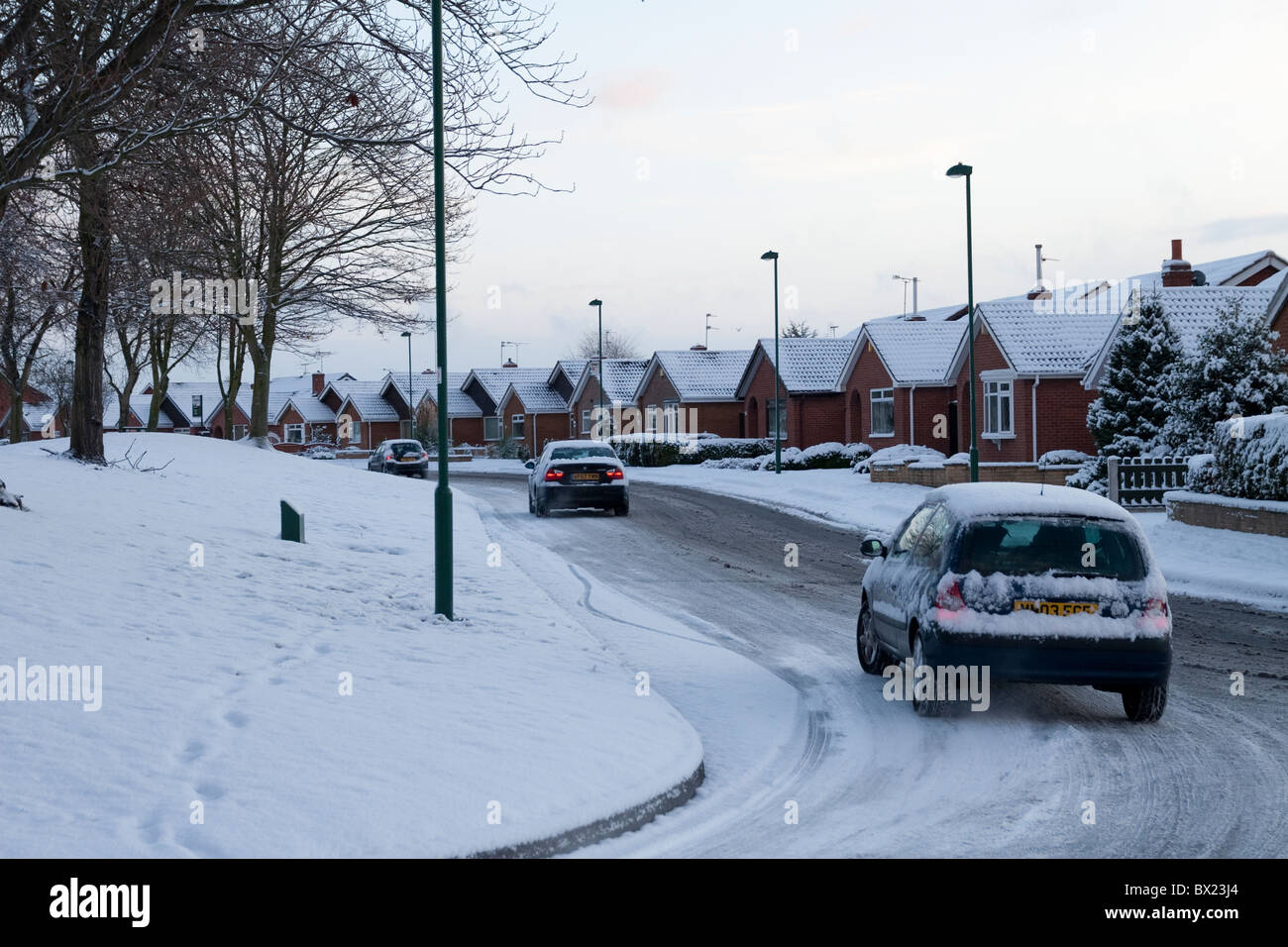 Cars braving the cold snow and ice to commute to work Stock Photo - Alamy