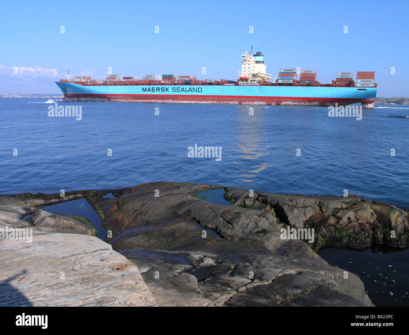 container freight hauler freighter industry rock Scandinavia sea ship ...
