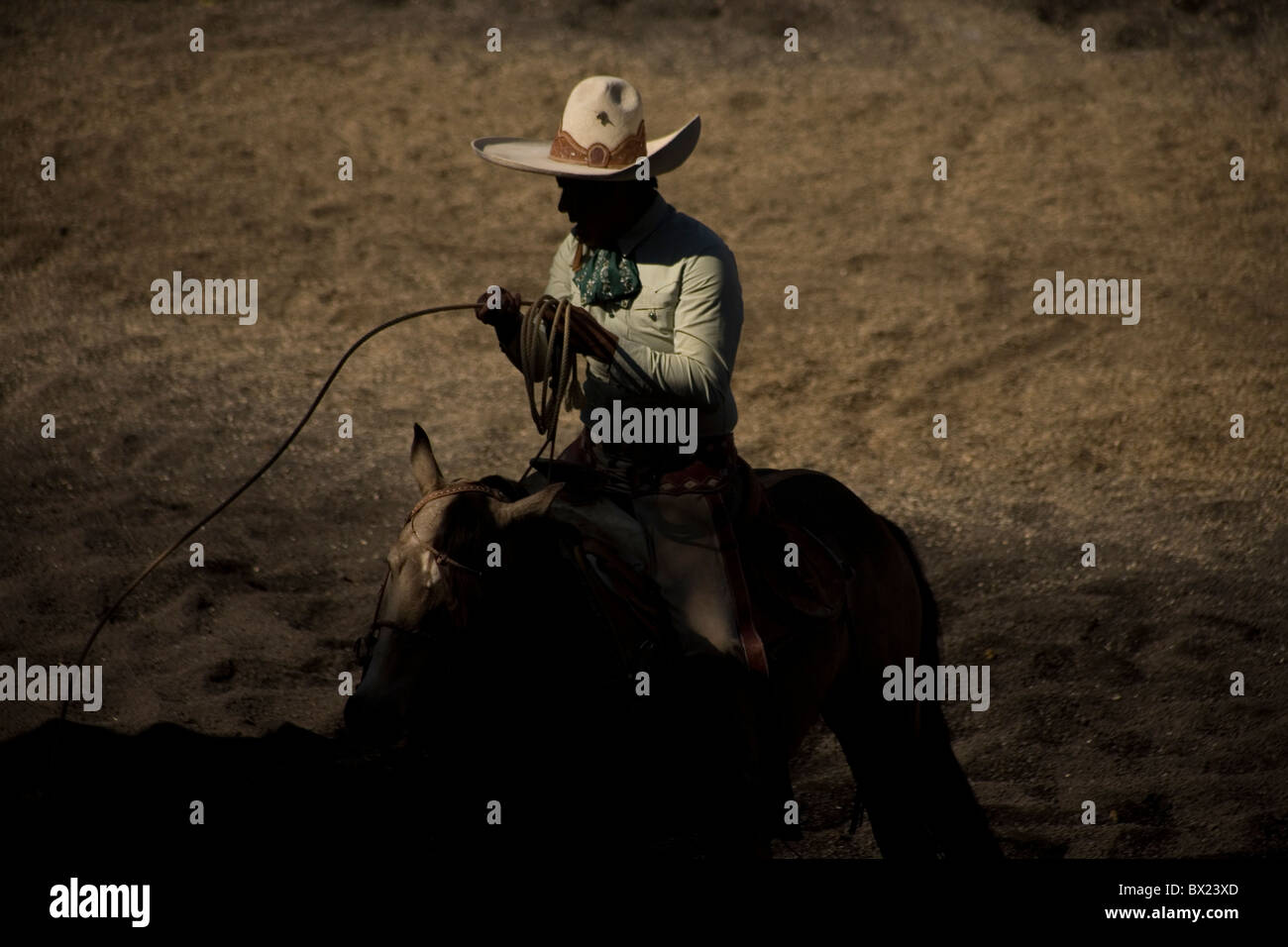 A Mexican Charro holds his lasso during a charreria exhibition in ...