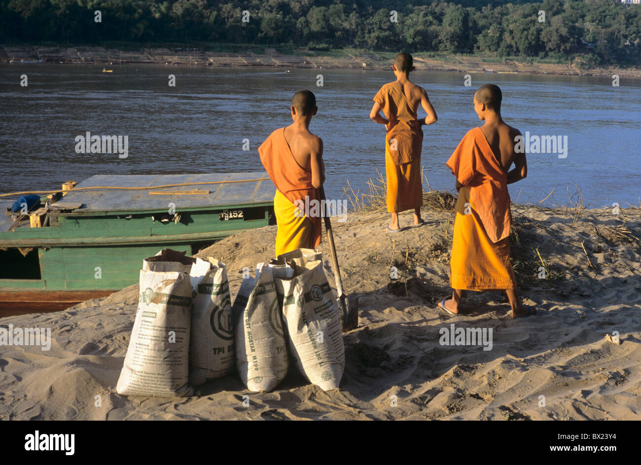 Laos Asia Luang Prabang Mekong river flow shore monks bags sand boats ...