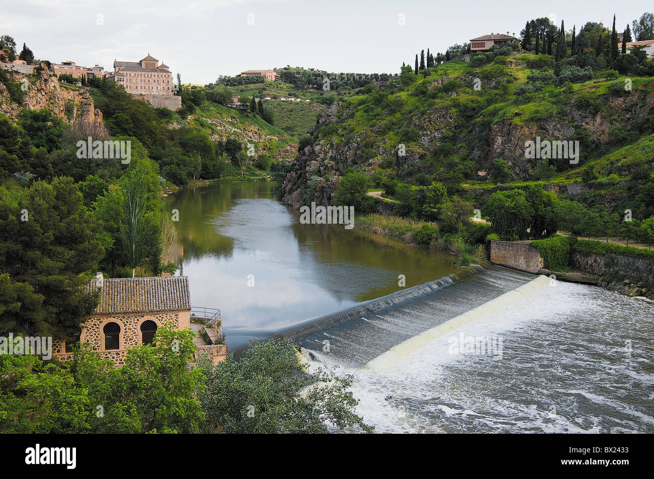 Waterfall on the Tajo river before crossing the San Martin Bridge in ...