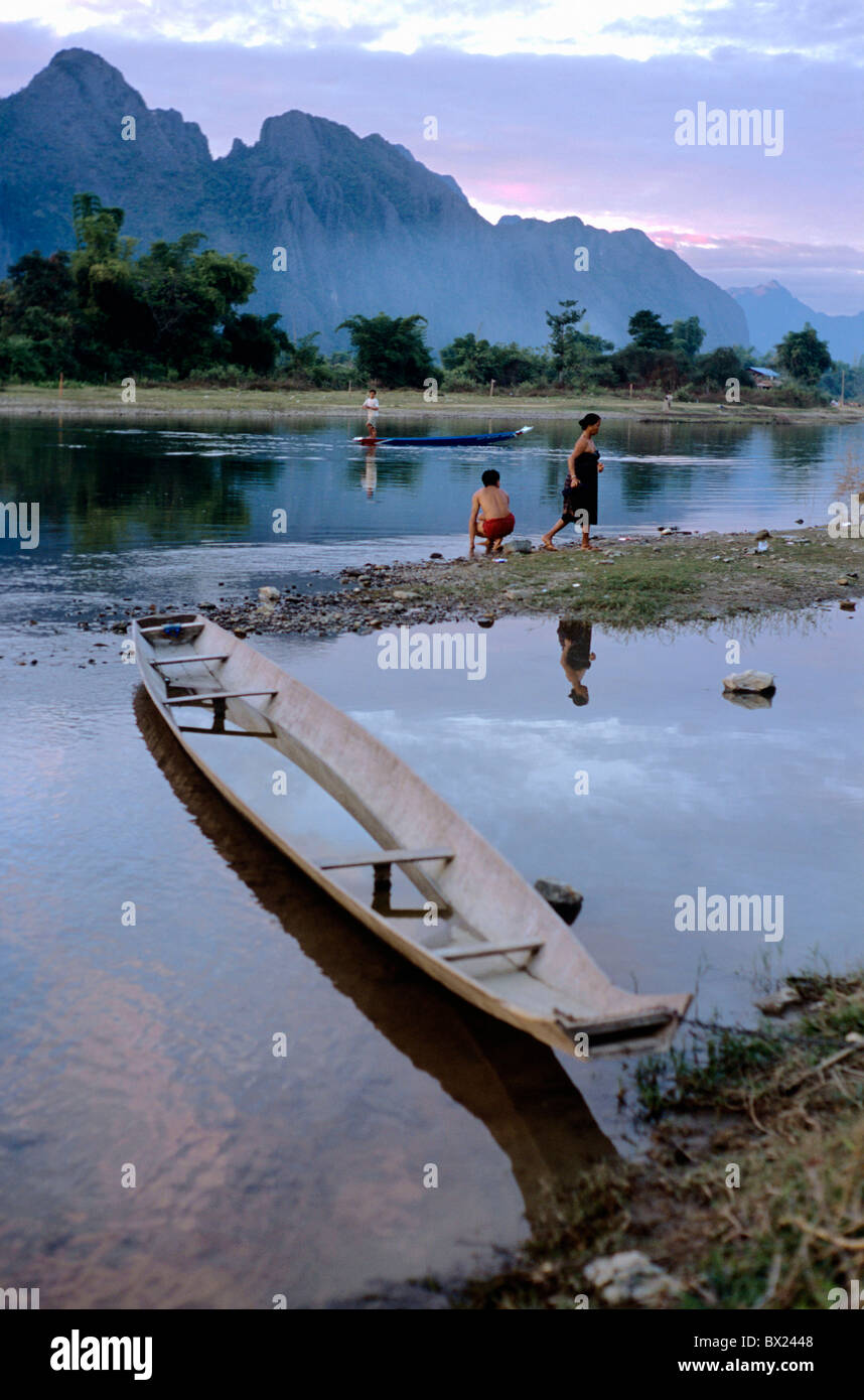 Laos Asia Vang Vieng river flow person bathing bath personal hygiene ...