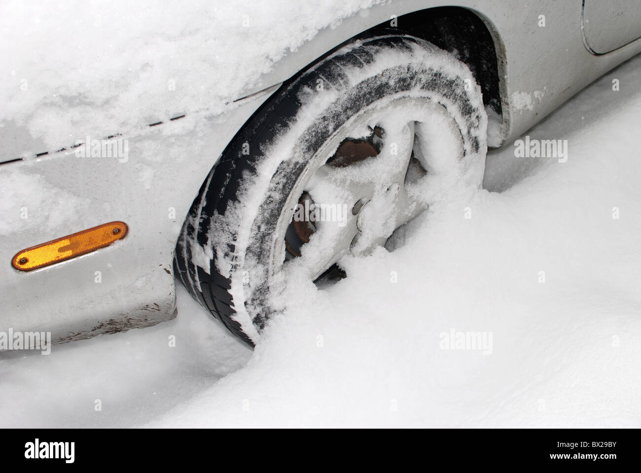 Automobile wheel and tyre in deep snow Stock Photo - Alamy