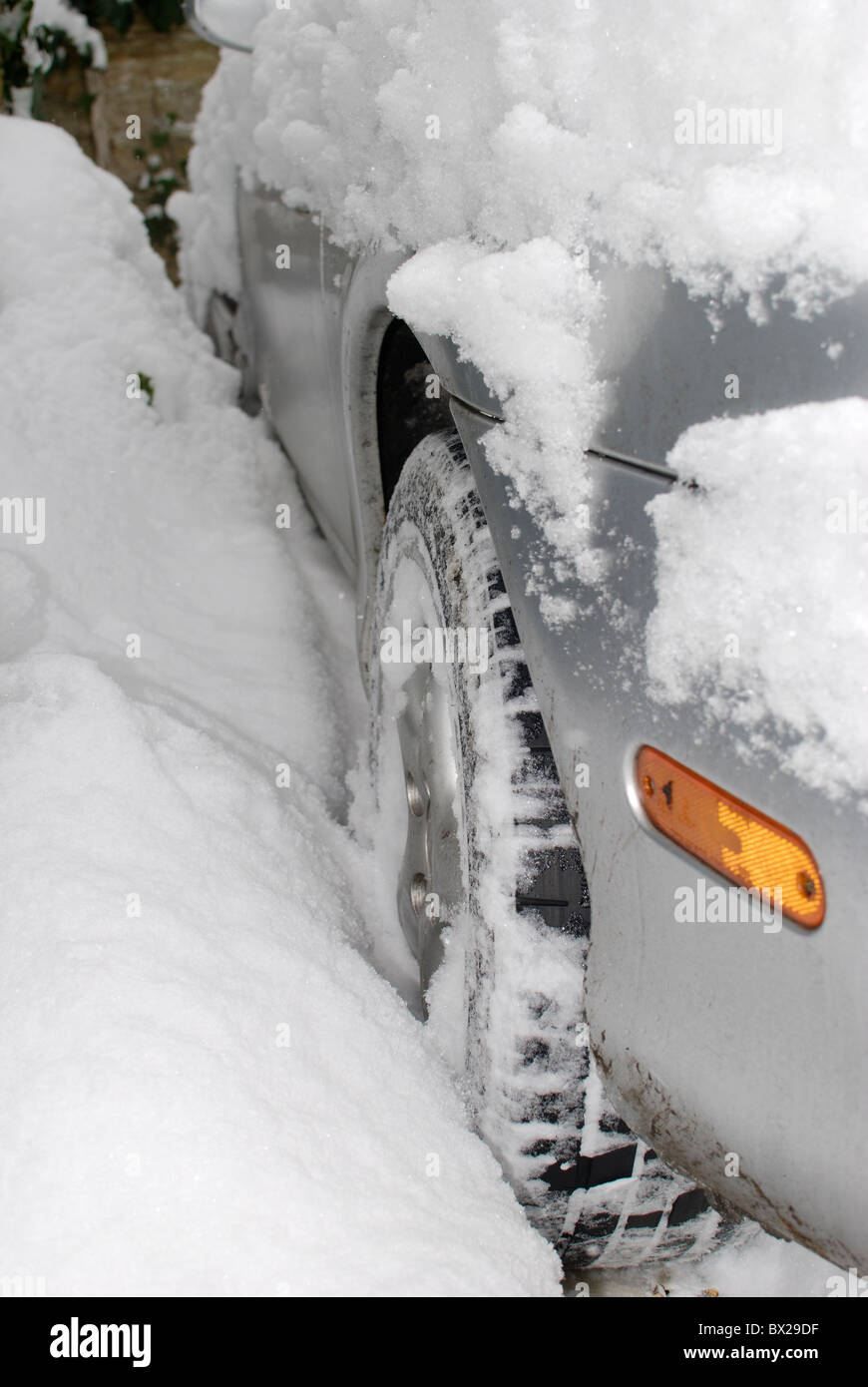 Automobile wheel and tyre in deep snow Stock Photo - Alamy