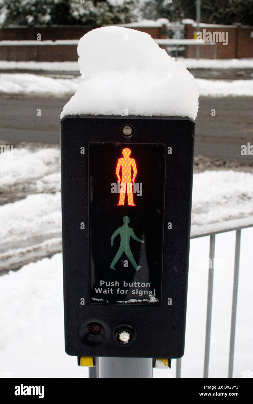 Pedestrian traffic light (Signal) with snow on. England. Signal at red ...