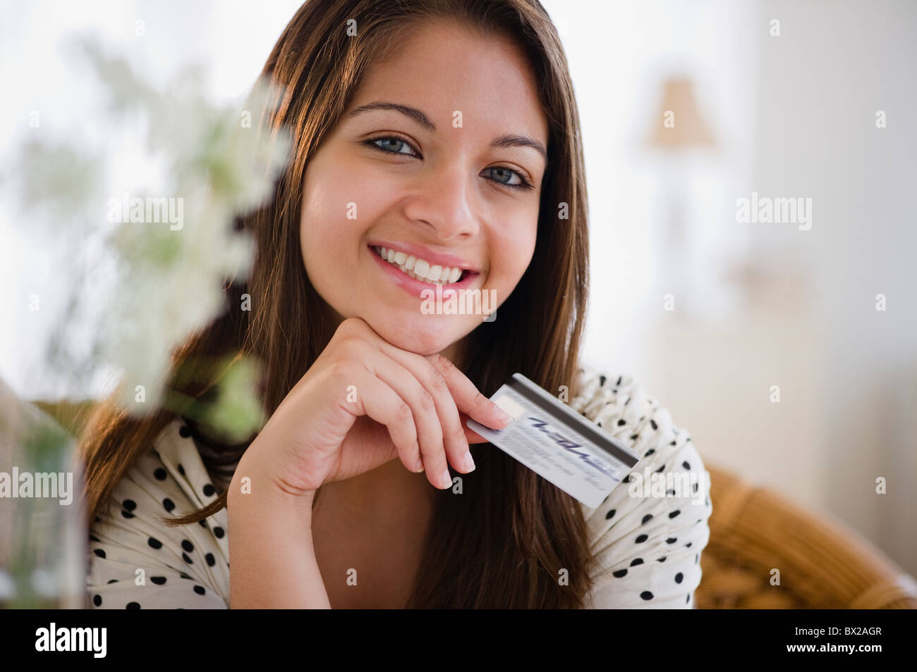 Smiling Indian woman holding credit card Stock Photo - Alamy Smiling Indian woman holding credit card Stock Photo - Alamy