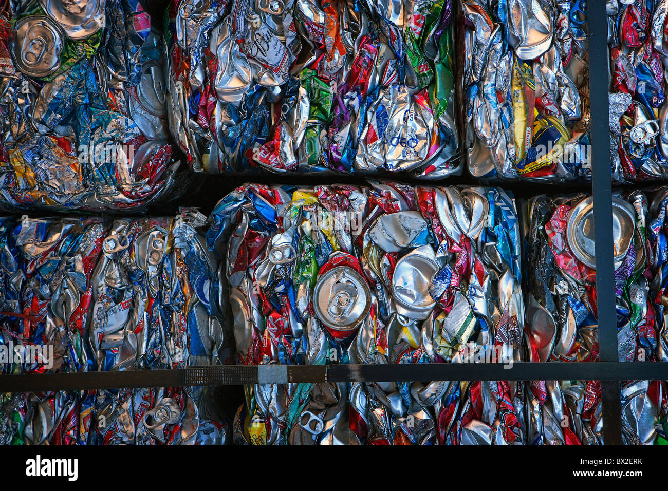 Crushed aluminum cans are cubed, baled, and stacked high ready for ...