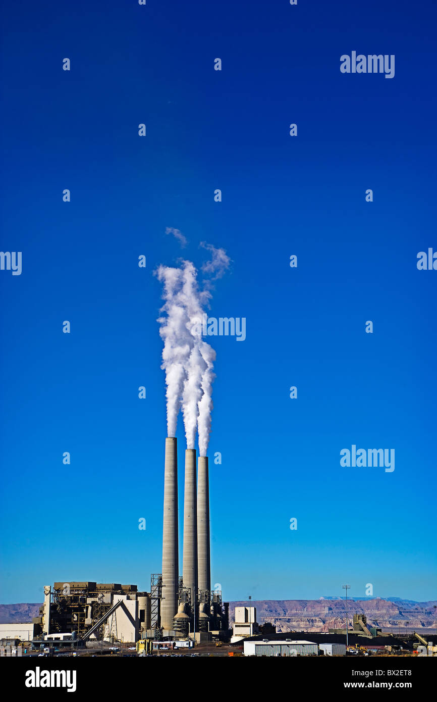 Smoke stacks reach high into the blue sky in northern Arizona in ...