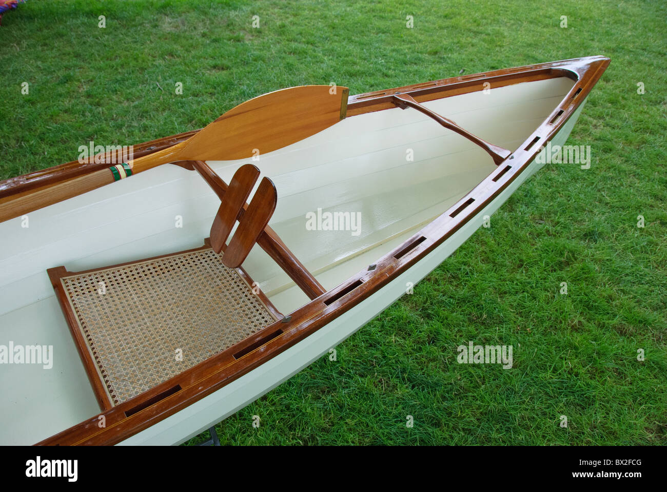 canoe with cane bench seat and single oar Stock Photo - Alamy