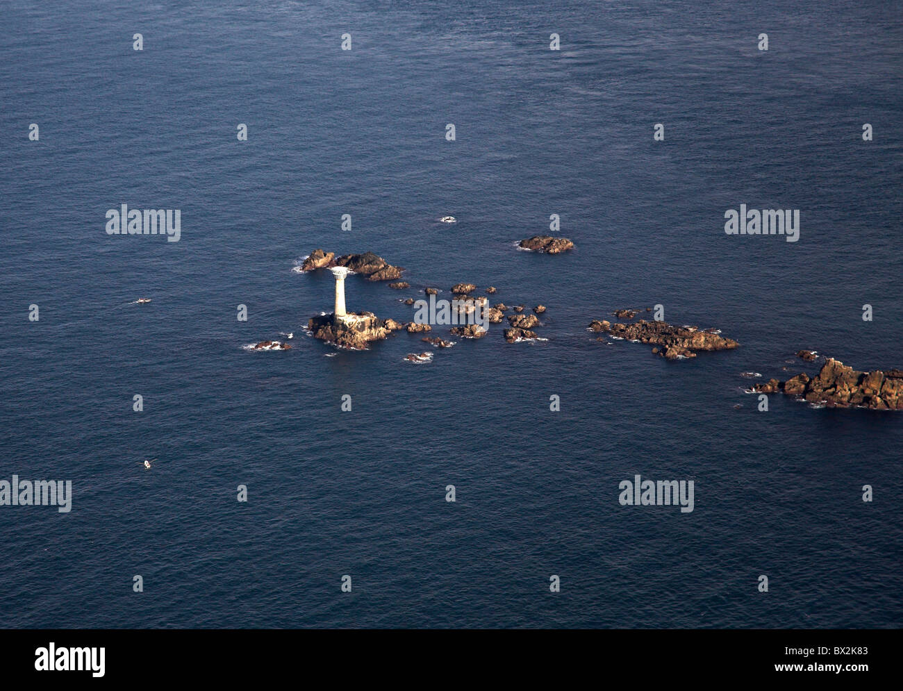 Aerial view from Isles of Scilly helicopter Longships lighthouse Lands ...