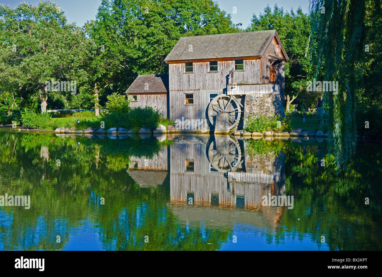 midway village pond old mill water reflection in water Stock Photo - Alamy