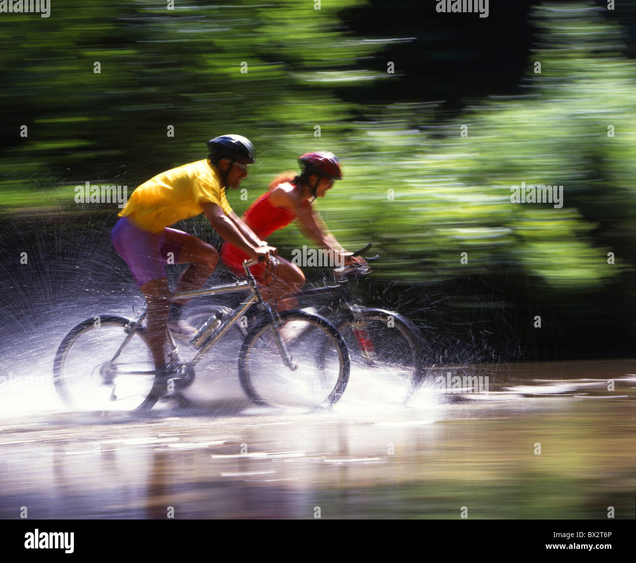mountain bike couple action water brook stream sports spare time ...