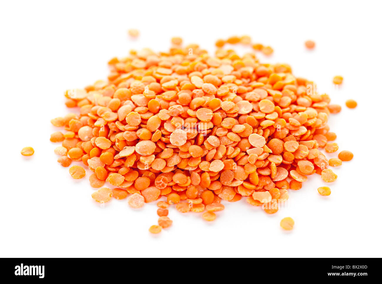 Heap of raw red lentils isolated on white background Stock Photo - Alamy