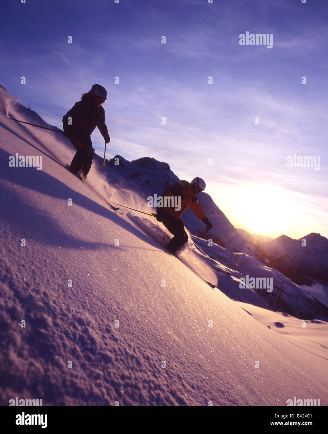 ski skiing couple steep slope sundown sunrise romantical Engadine ...