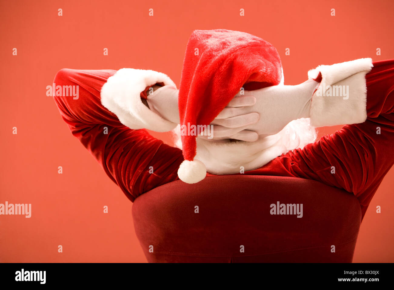 Back view of Santa Claus keeping his hands behind head Stock Photo - Alamy