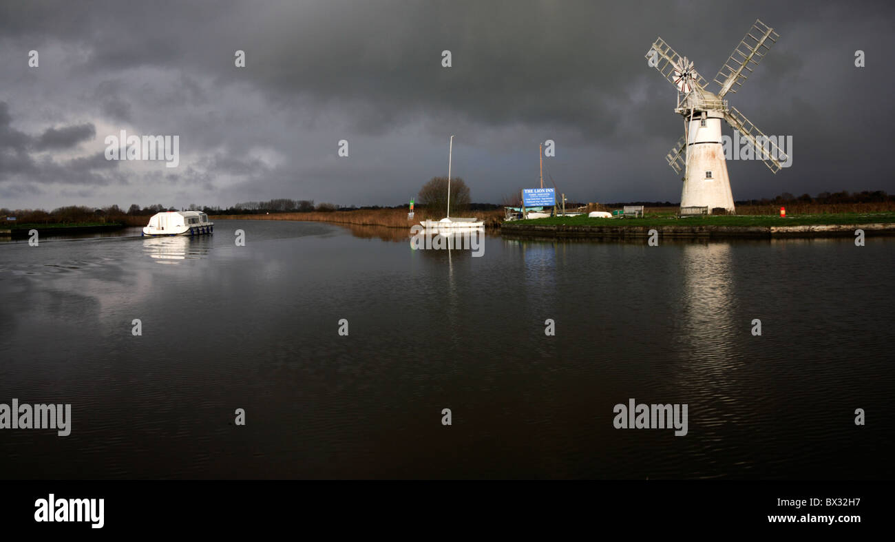 A panoramic scene with winter cruising on the River Thurne on the ...