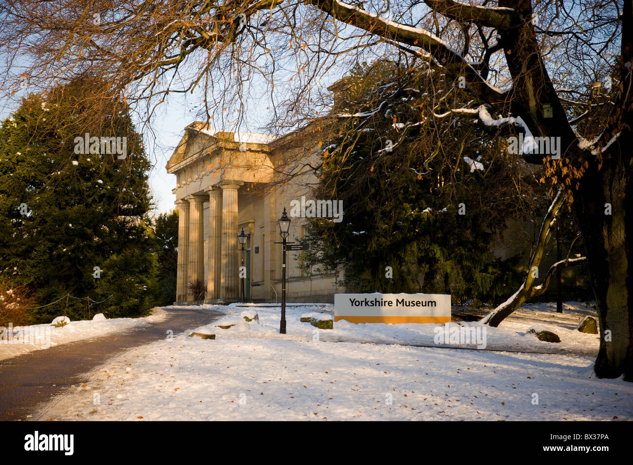Yorkshire Museum frame by a snow covered tree branch in Museum Gardens ...