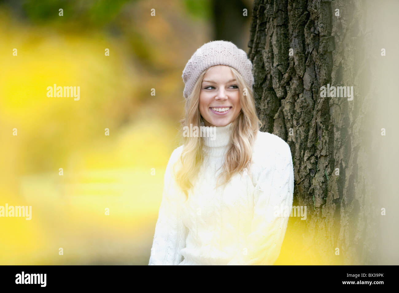portrait of teenage girl leaning against tree Stock Photo - Alamy