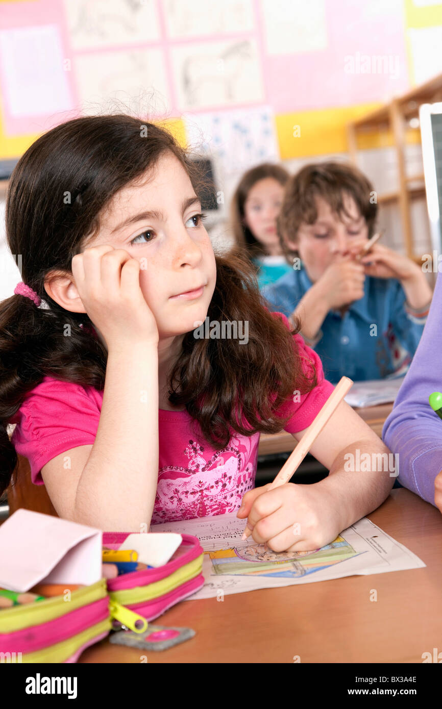 portrait of young girl sitting in classroom Stock Photo - Alamy
