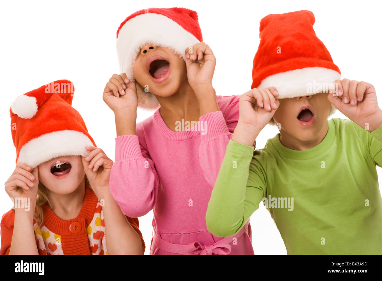 Photo of happy friends in Santa caps having fun together Stock Photo ...