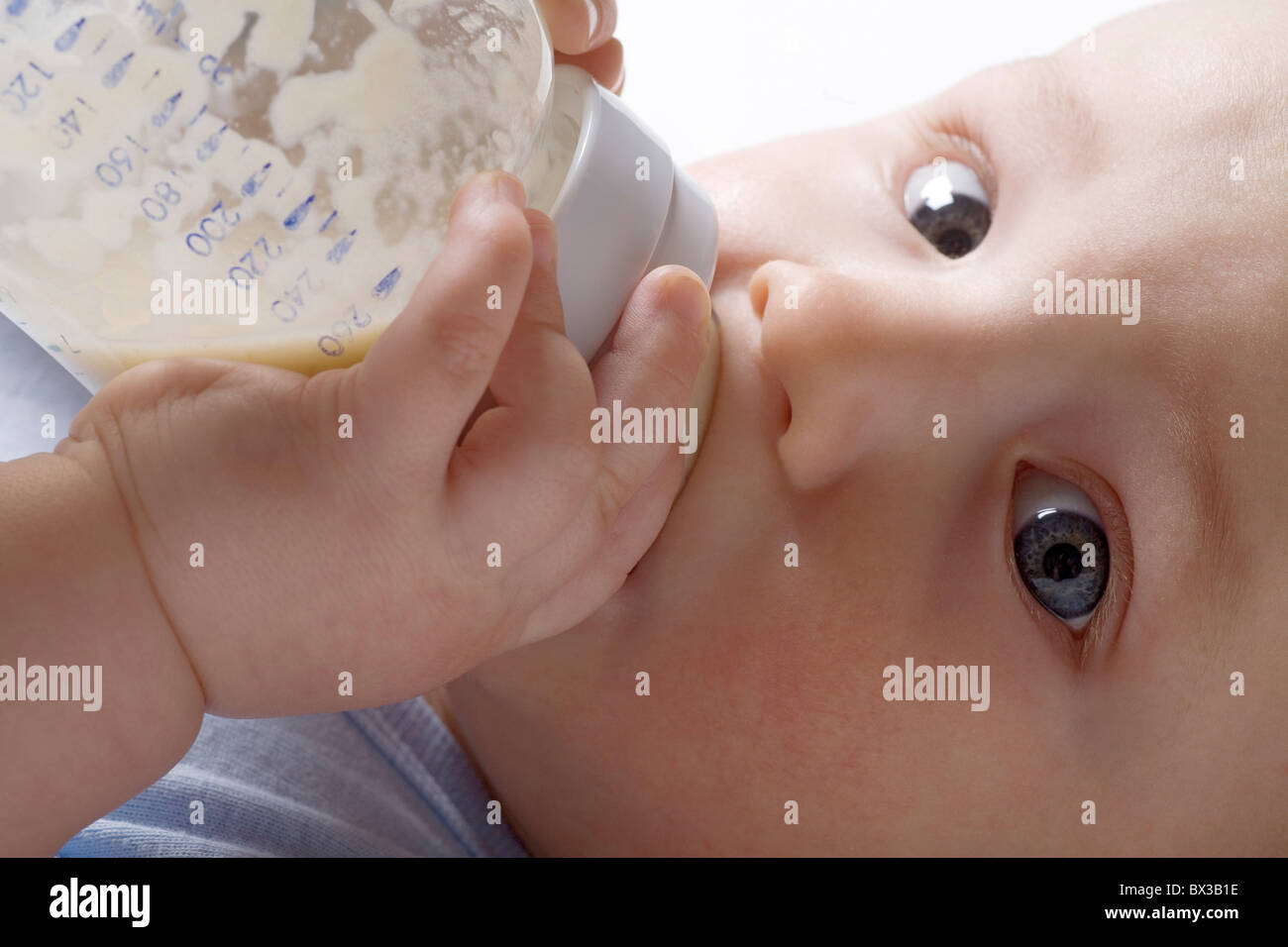 headshot of baby boy drinking from baby bottle Stock Photo - Alamy