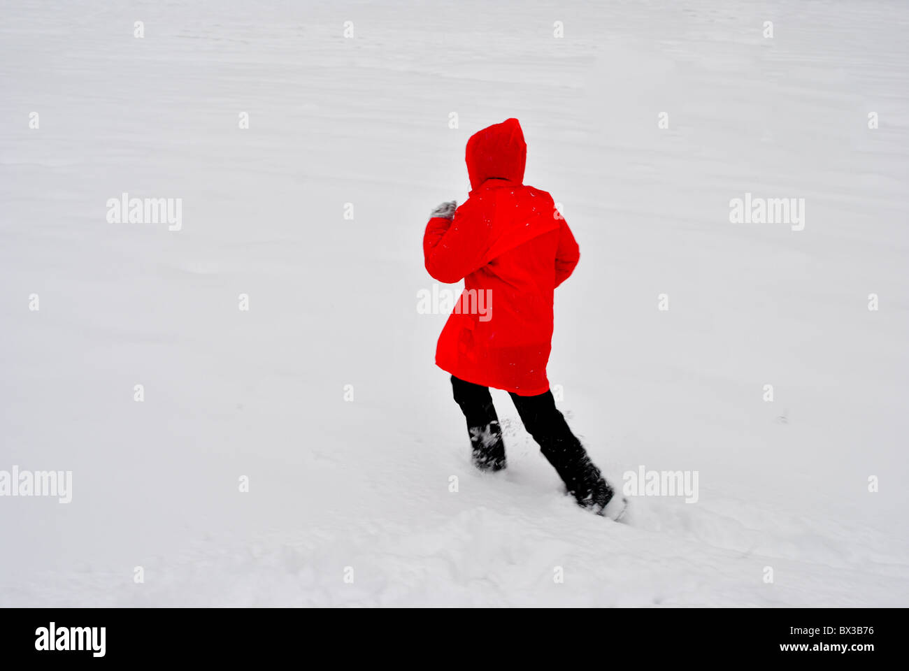 Red jacket in motion hi-res stock photography and images - Alamy