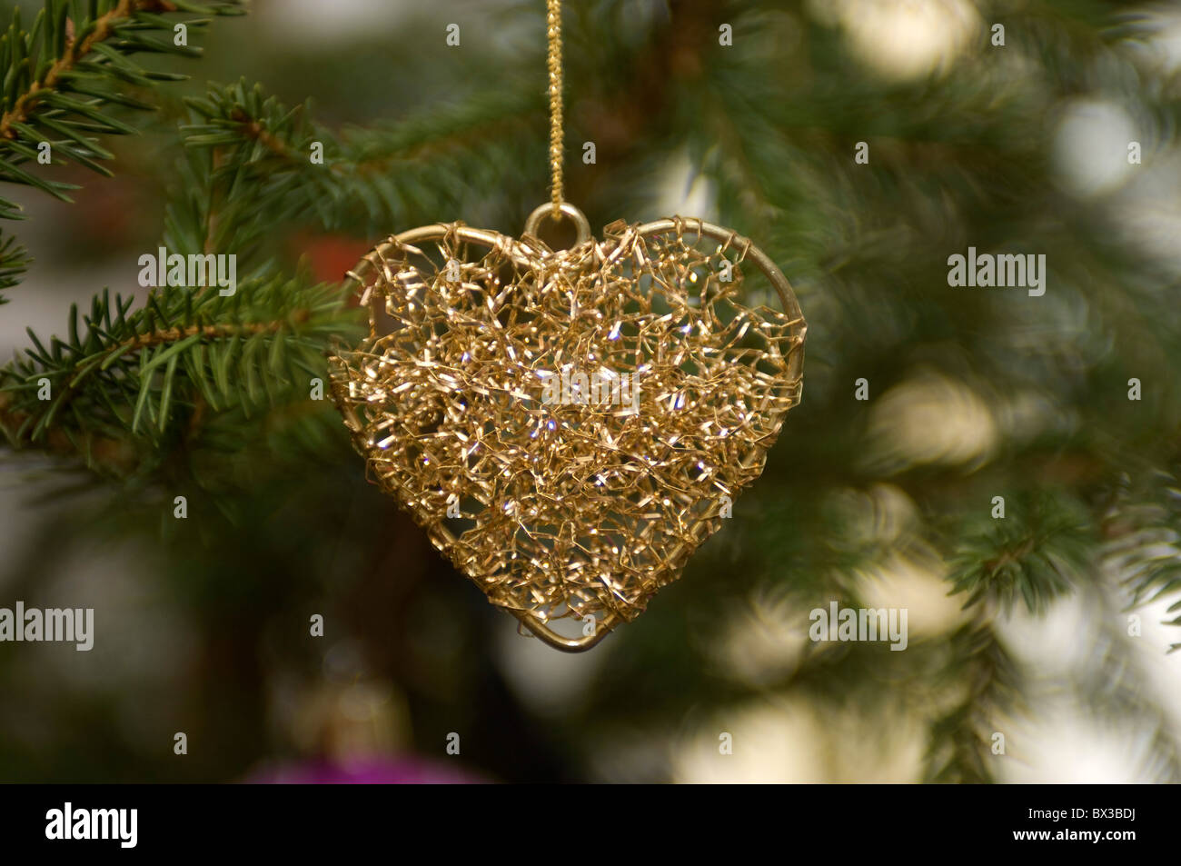 decoration in shape of heart hanging on christmas tree Stock Photo - Alamy