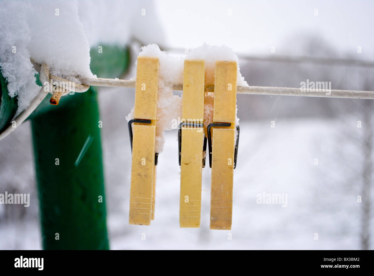 pegs in the snow Stock Photo - Alamy