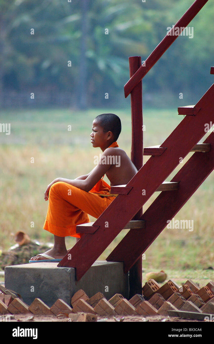 young monk resting on the stairs Stock Photo - Alamy