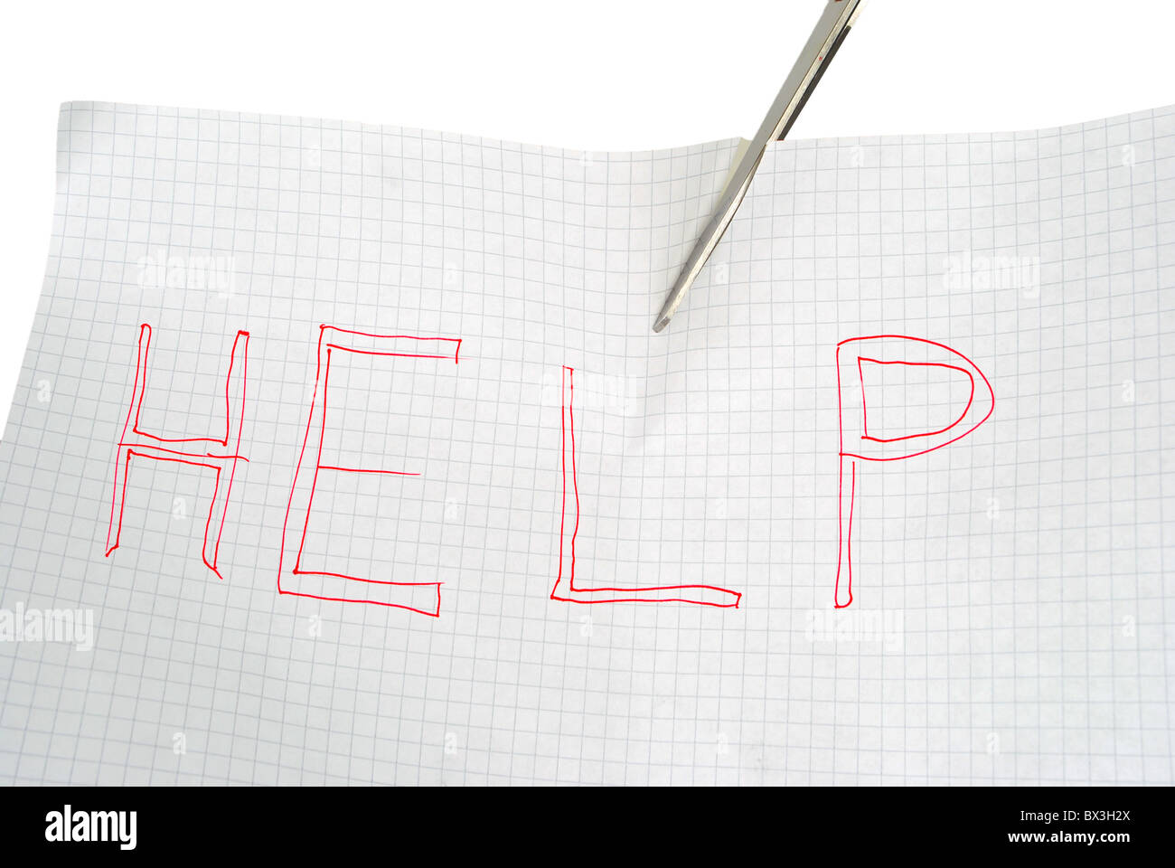 sheet of paper with scissors and writing help Stock Photo - Alamy