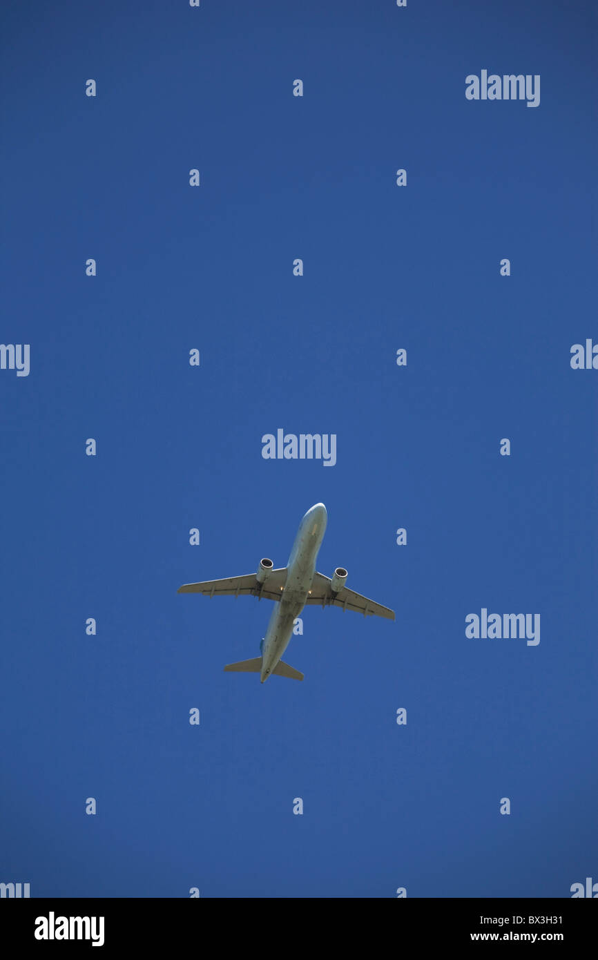 Commercial Airplane In Flight; Calgary, Alberta, Canada Stock Photo - Alamy