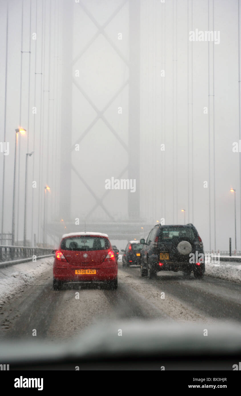 Cars crossing the Forth Road Bridge in bad winter conditions Stock ...
