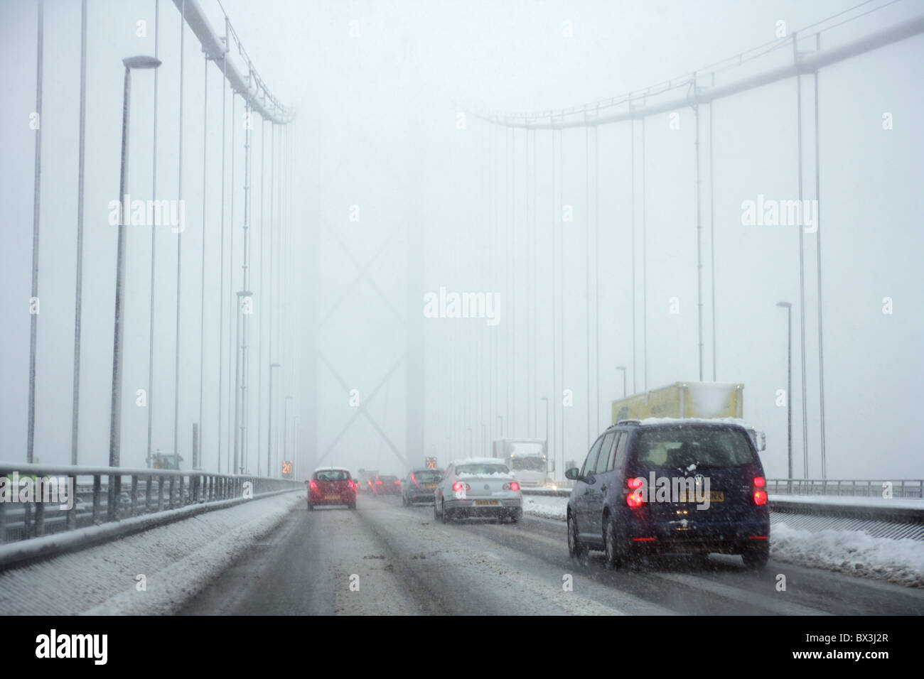 Cars crossing the Forth Road Bridge in bad winter conditions Stock ...