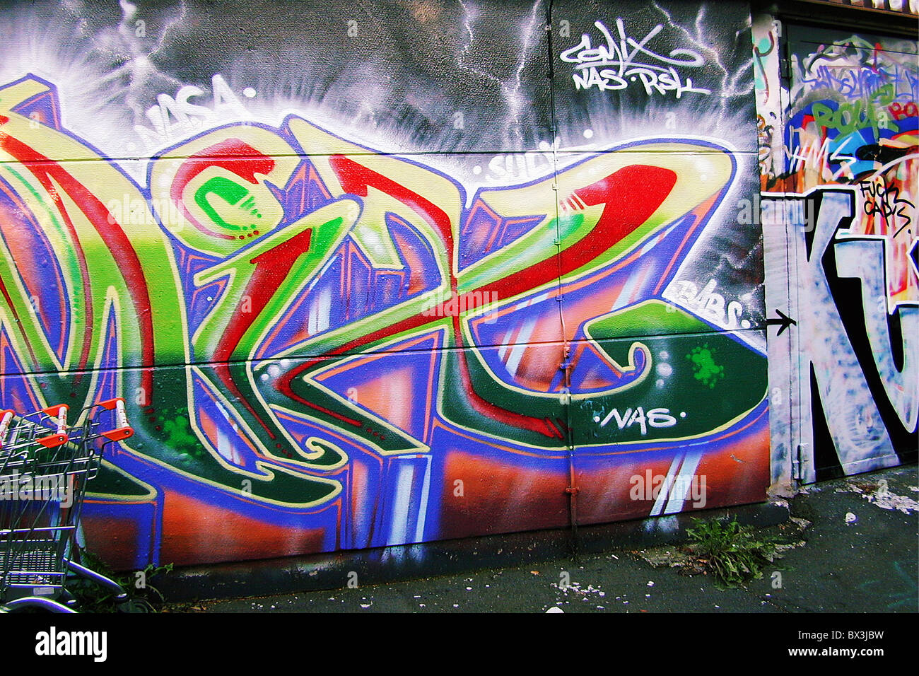 graffiti sprayed damage to property wall spraying Stock Photo - Alamy