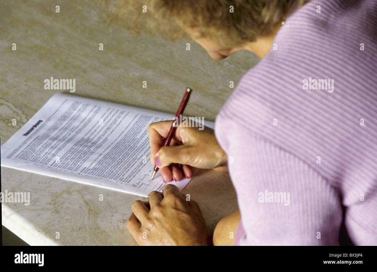 contract signing signature writing letter woman Stock Photo - Alamy