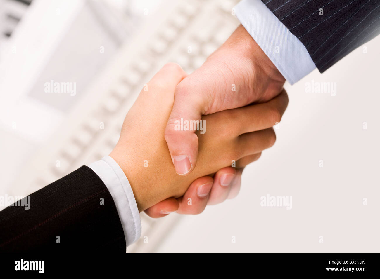 Photo of handshake of business partners after signing promising ...