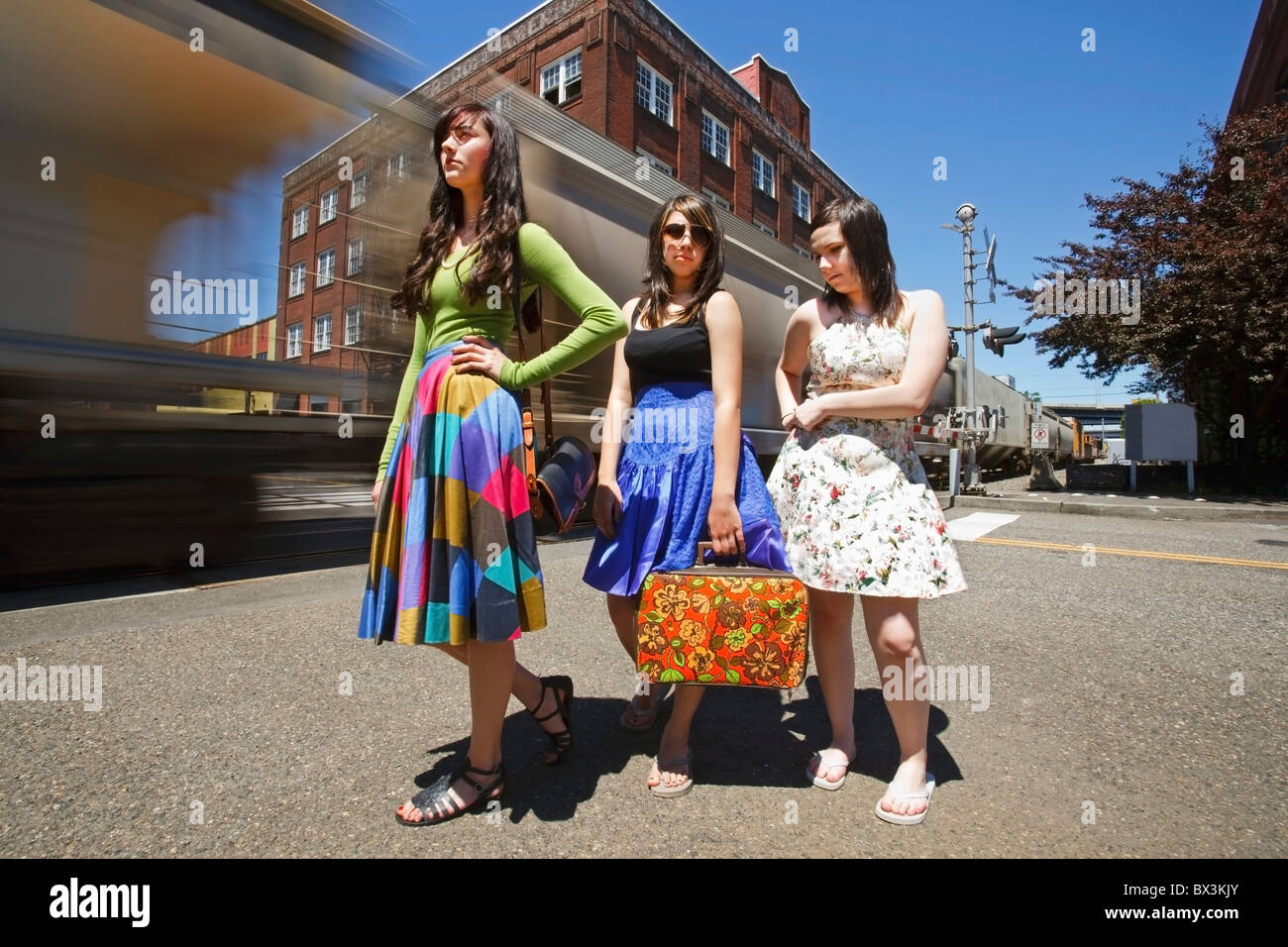 Teenage Girls Waiting For A Train In Downtown; Portland, Oregon, United ...